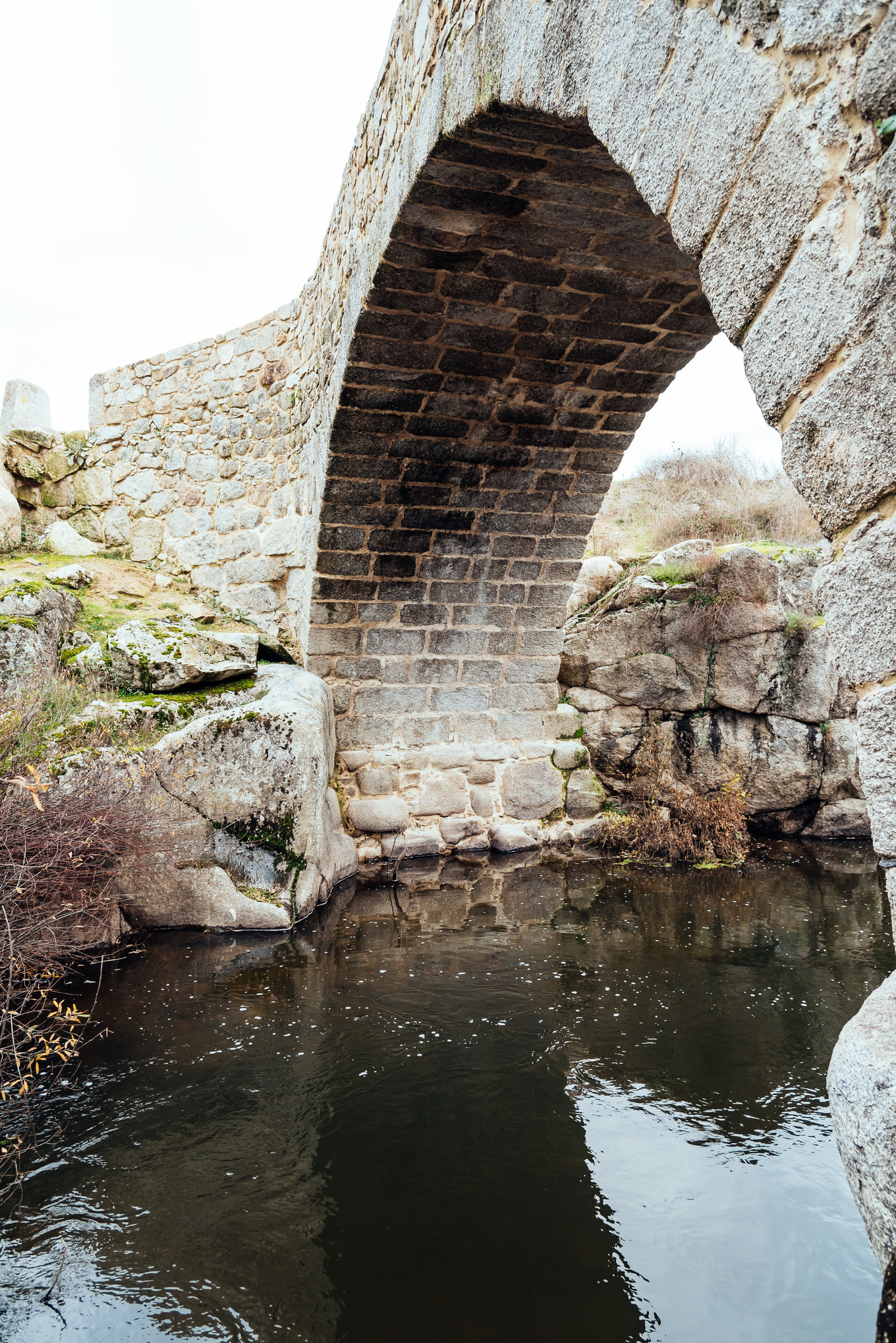 Medieval stone bridge containing boulder, bridge - built structure, and ...