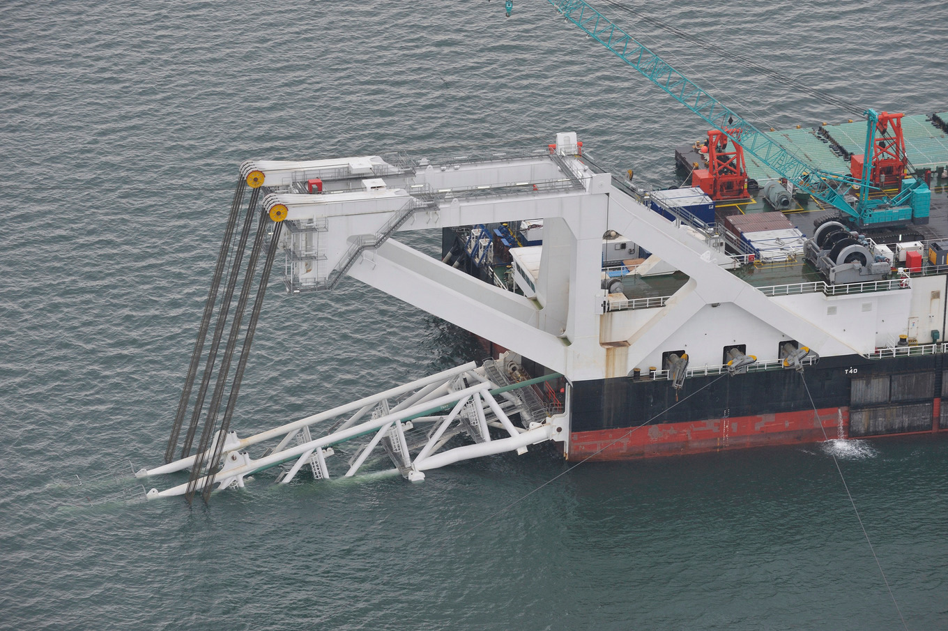 The pipelaying barge featuring pipelayer, pipelay, and barge, a ...