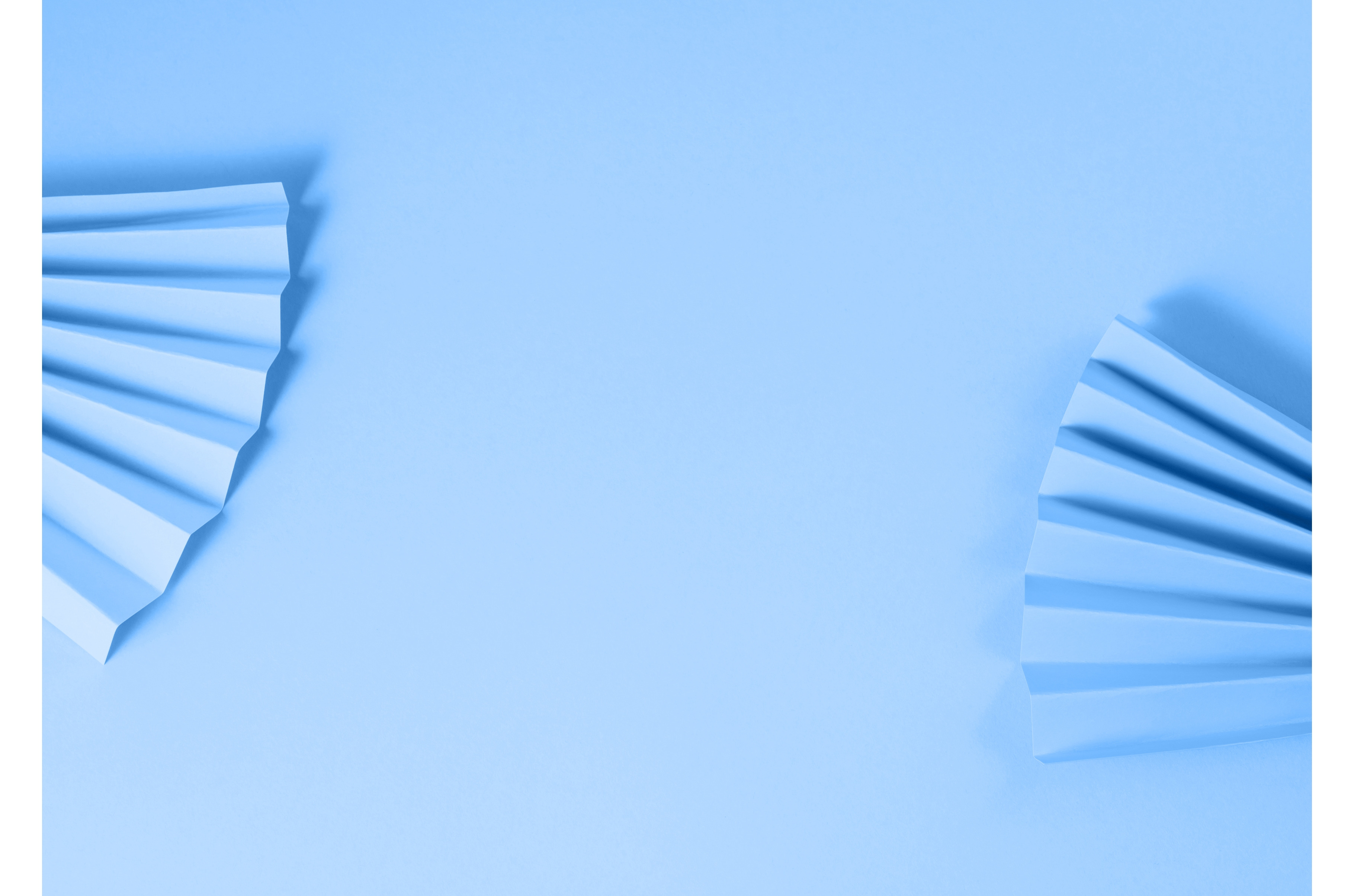 Pastel color paper fans on blue, an Abstract Photo by Lifemorning