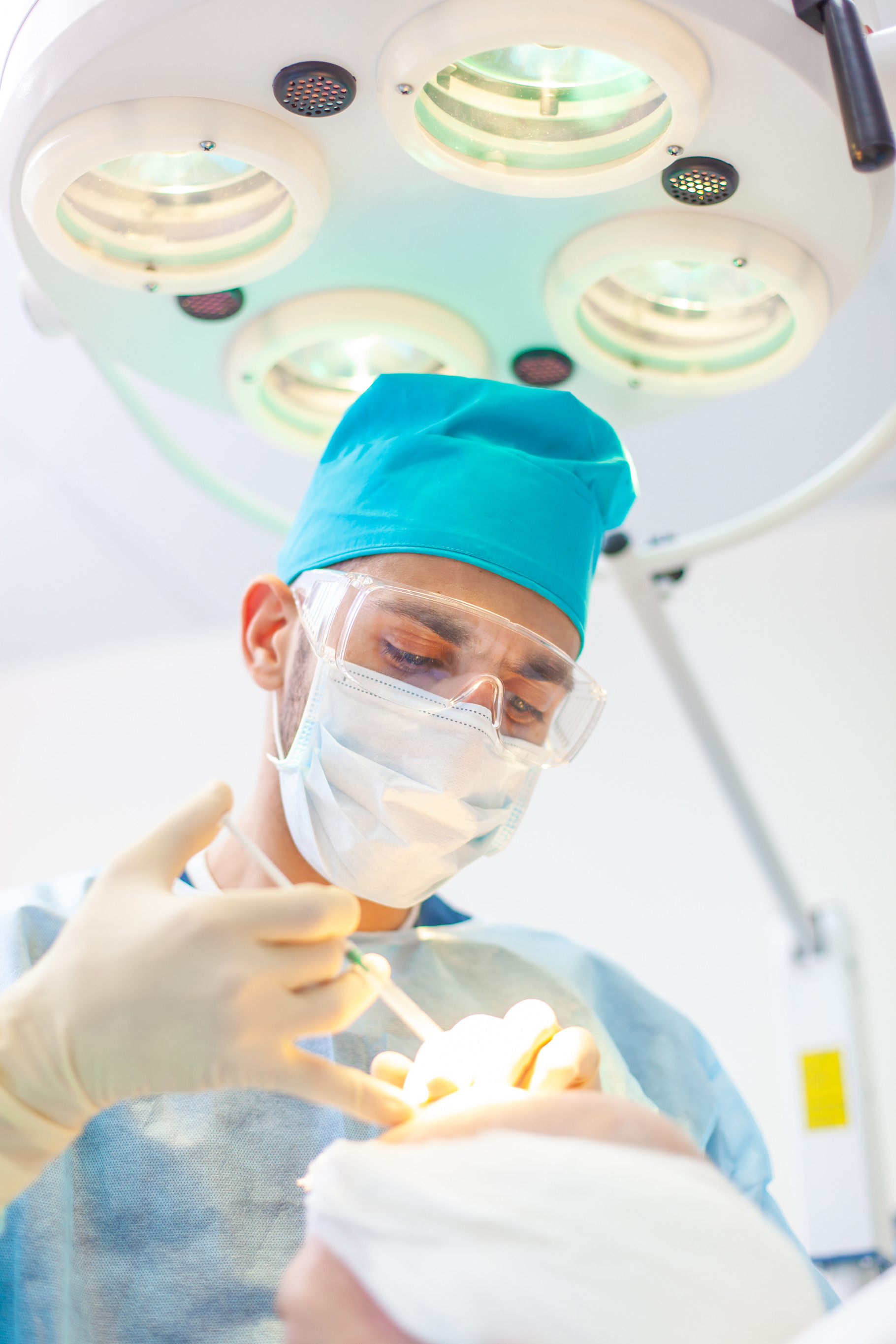 The surgeon gives injections to the featuring hair, transplant, and ...