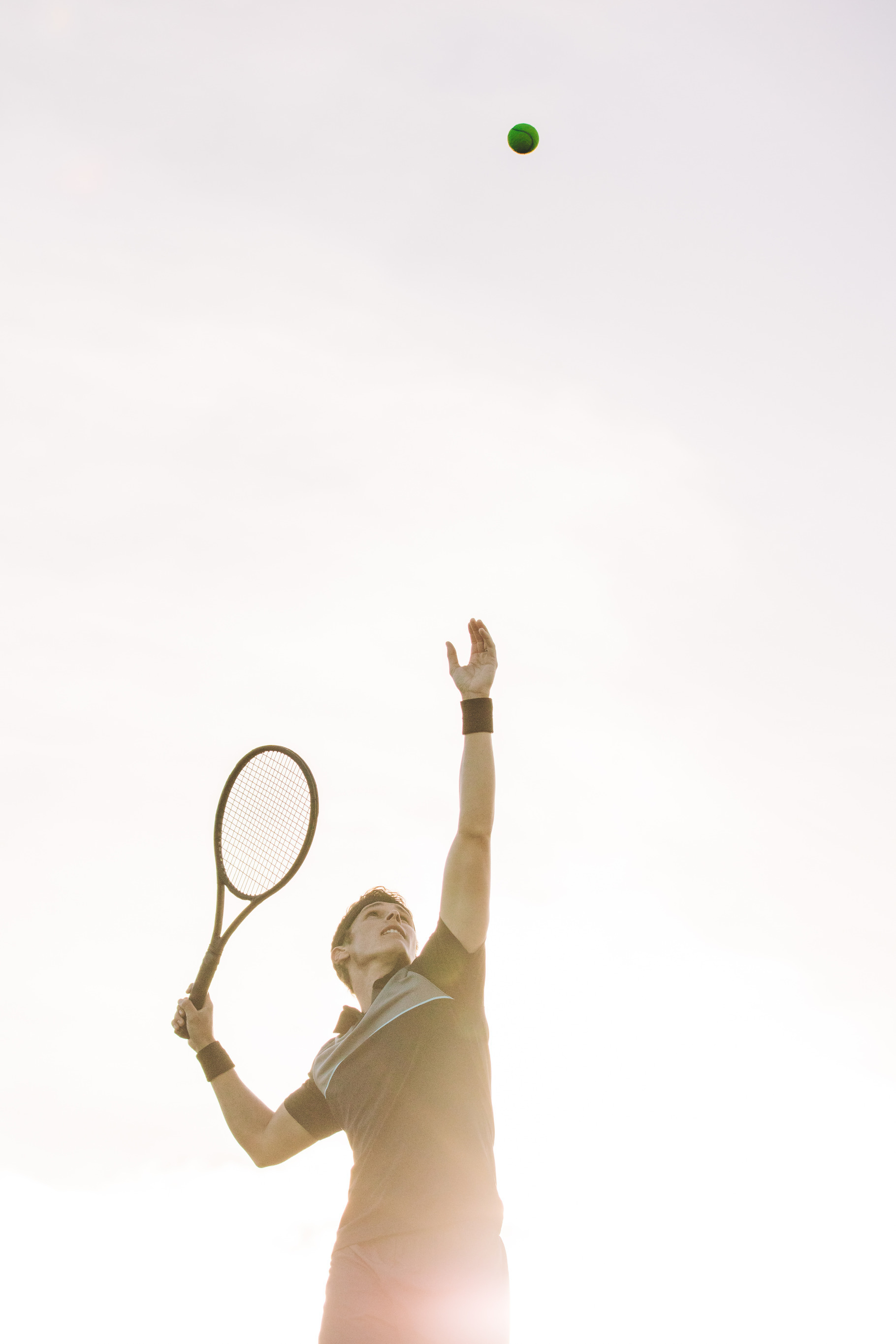 Tennis player serving a ball, a Sports & Recreation Photo by Jacob Lund