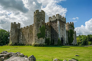 This historic stone castle features, a Photo by Tanuart