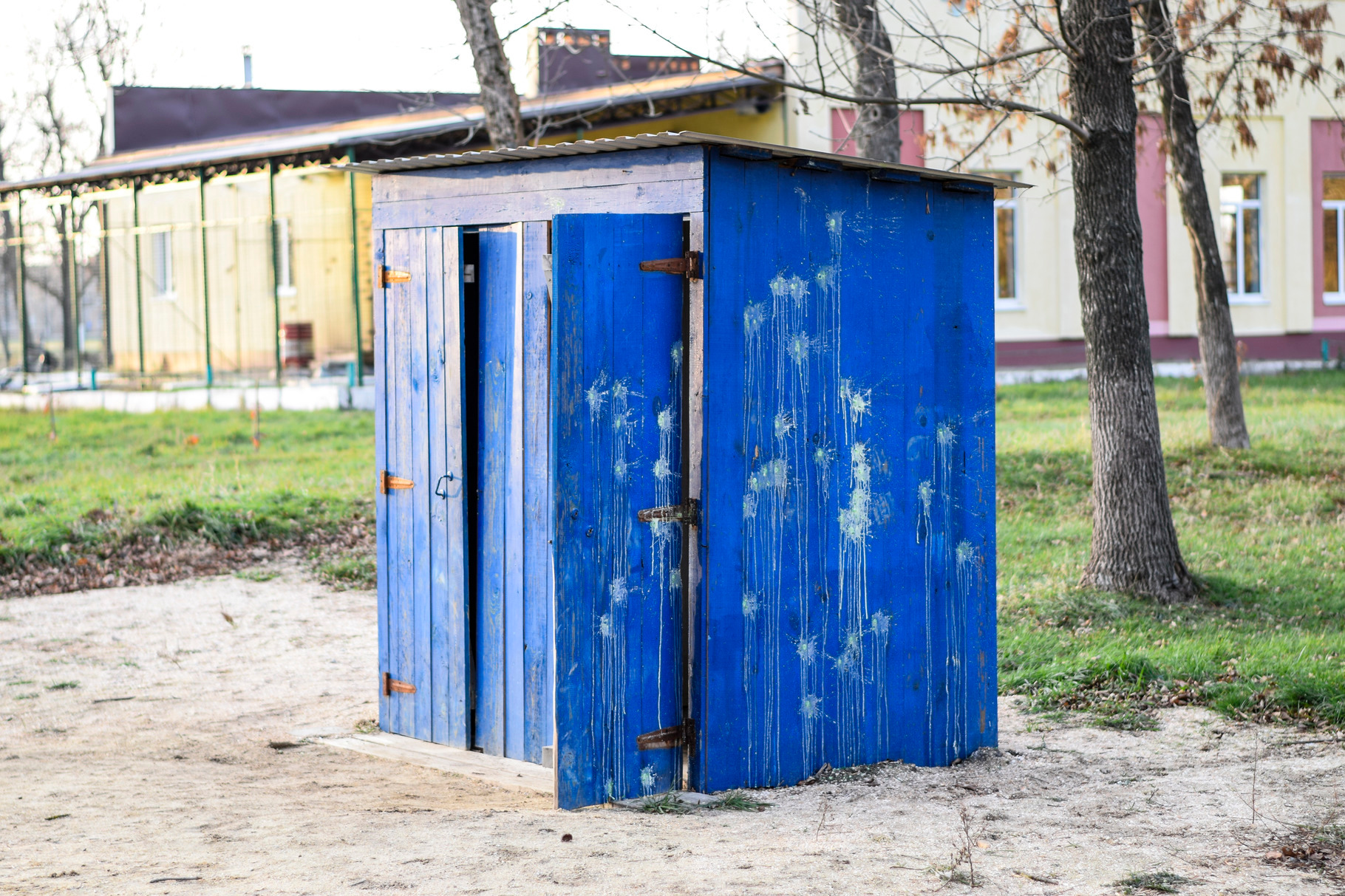 Public toilet in a street park blue featuring bio, blue, and green, an ...