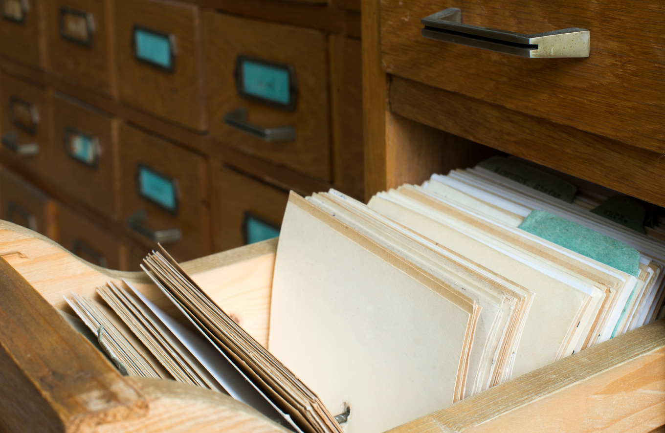 Old archive with drawers featuring card, old, and catalog, an ...