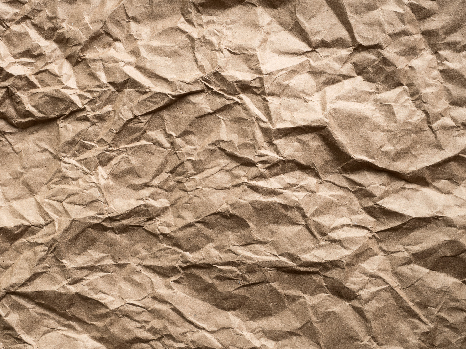 Brown crumpled craft paper, an Abstract Photo by Anton Belo