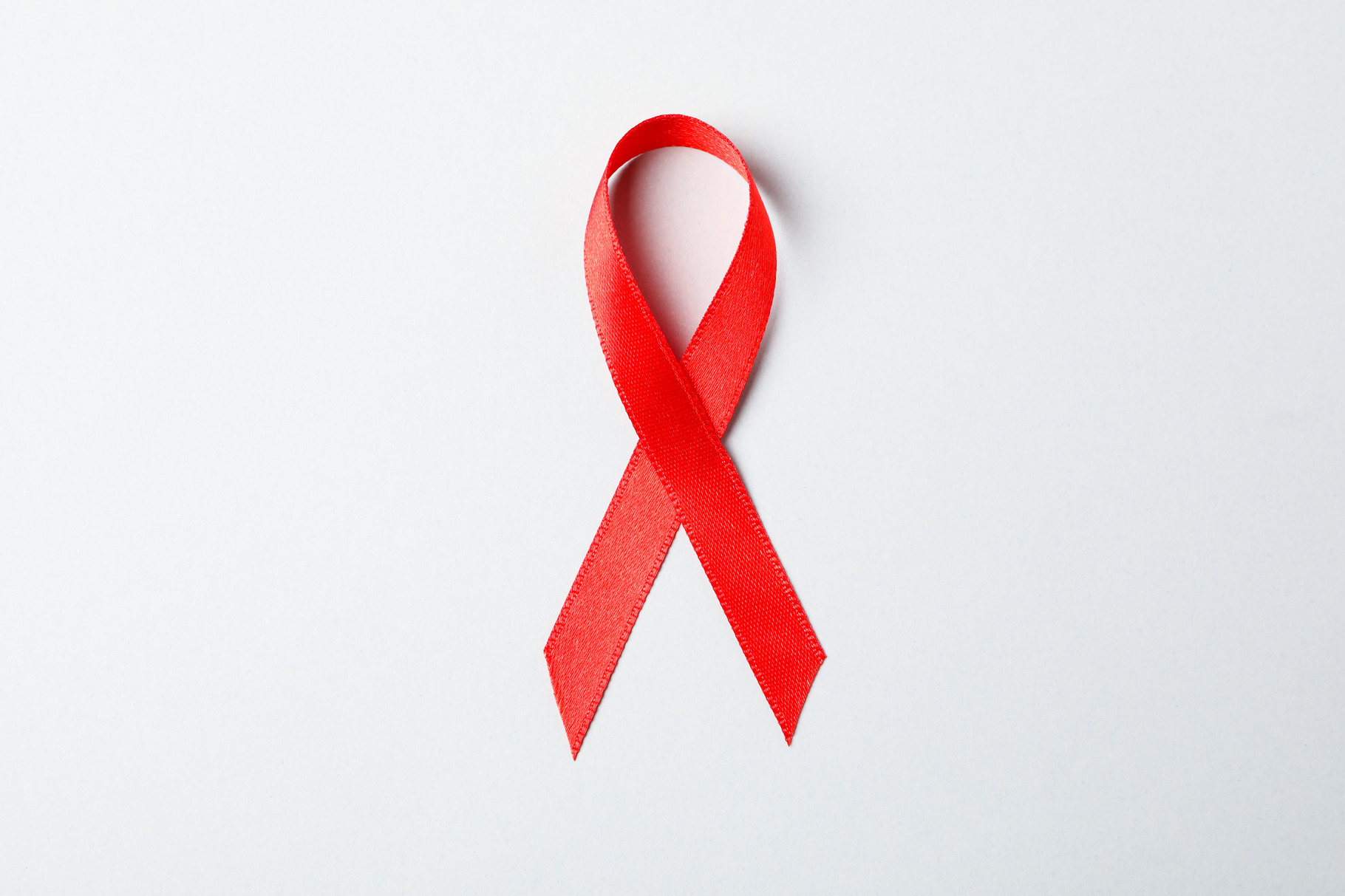 Red awareness ribbon on red background, space for text, a Health ...