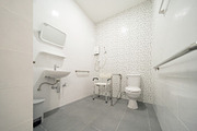 Public handicap toilet for disable people. Men bathroom doors in, a ...