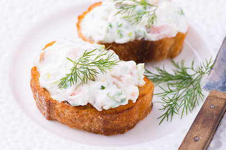 Canape with soft cheese spread featuring salmon, soft cheese, and ...