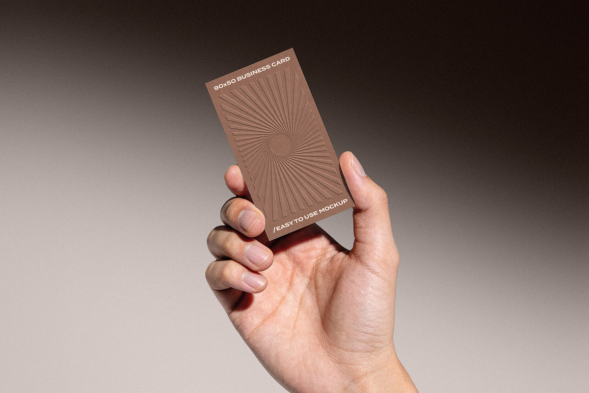 90x50 Business Card in Hand Mockup, a Pens & Pencil Mockup by Design Squad