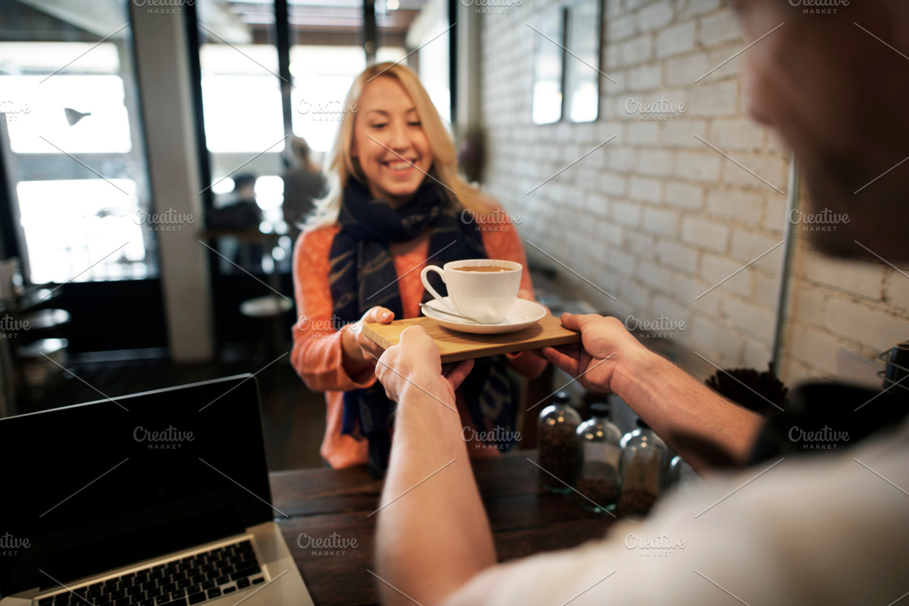 Staff handling coffee to customer, a Photo by rawpixel | Creative Market