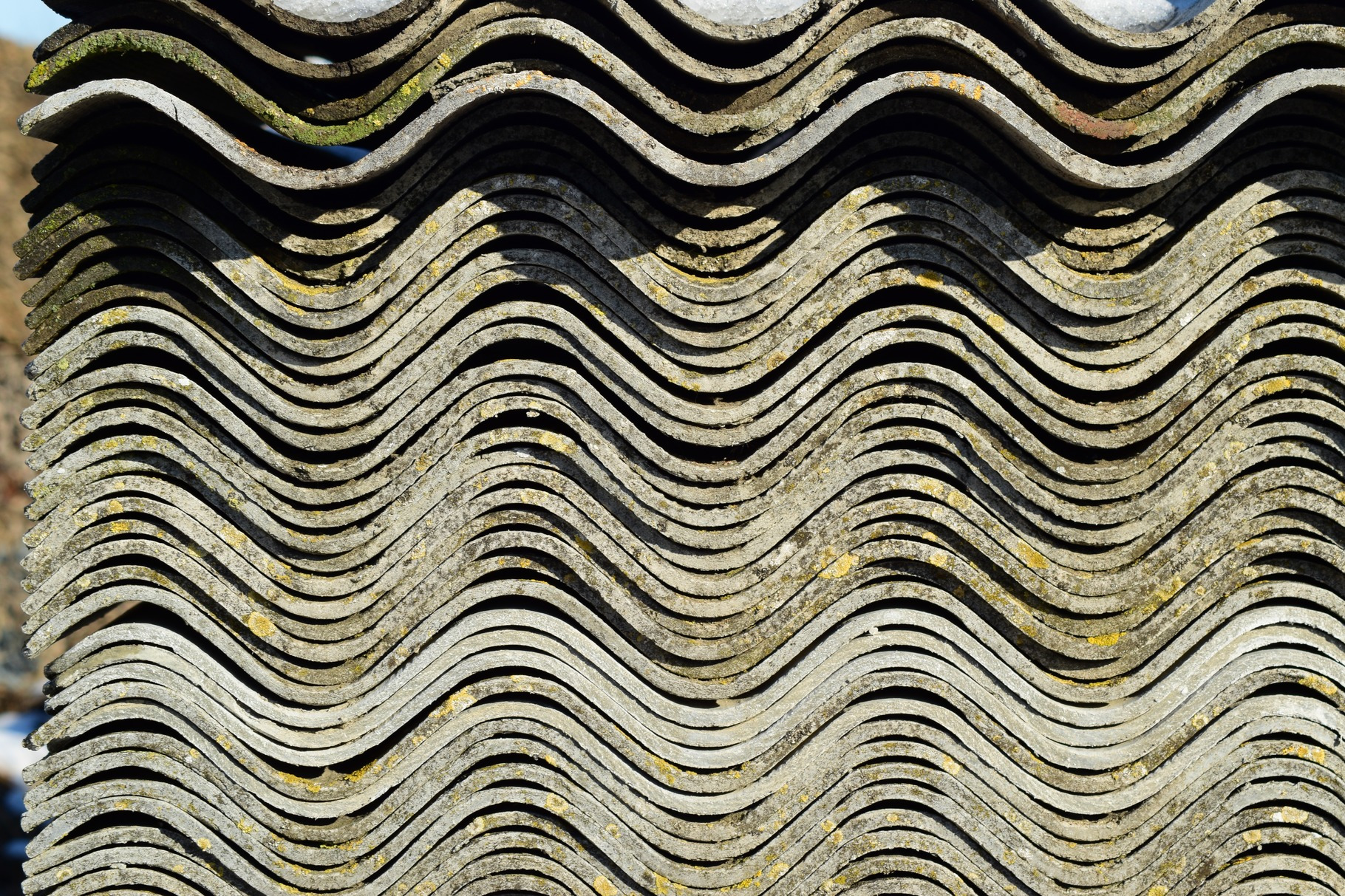 Corrugated slate lies in a pile side view background texture of slate ...