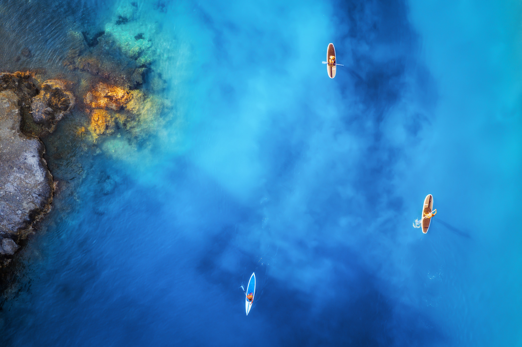 Aerial view of people on floating sup boards on blue sea, a Nature ...