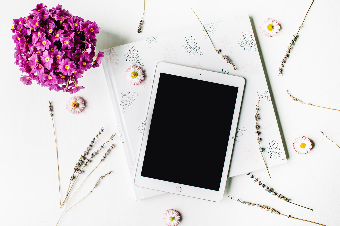 Tablet, wedding album and flowers, a Technology Photo by Floral Deco