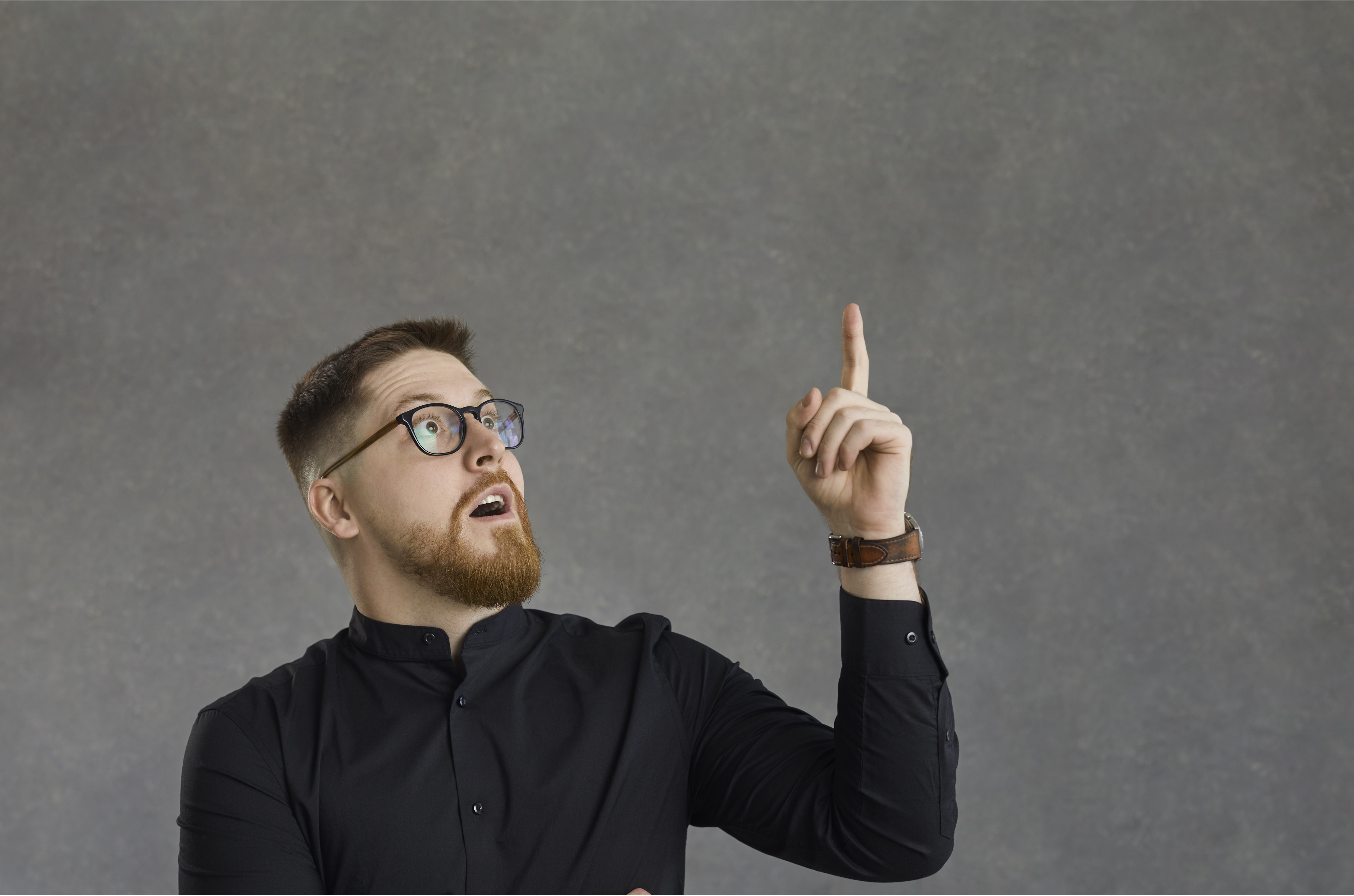 Smart excited caucasian man pointing, a Person Photo by StudioRomantic