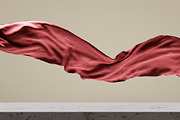 Luxury red fabric floating above marble table. Abstract beauty a, a ...