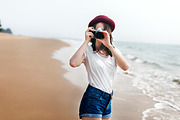 Woman travel photographing beach featuring attractive, beach, and ...