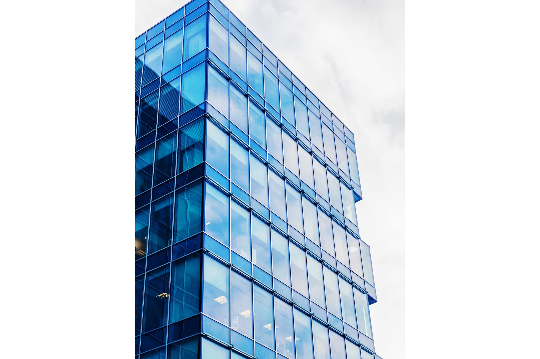 Office building exterior featuring glass, architecture, and city, an ...