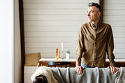 Smiling middle aged white man standing, a Person Photo by Dean Drobot
