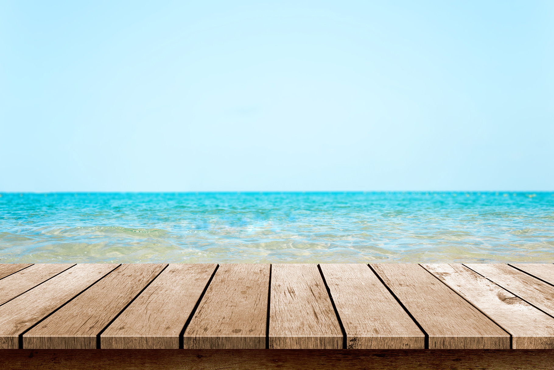 Wood table top with beach background, a Holiday Photo by kaisorn