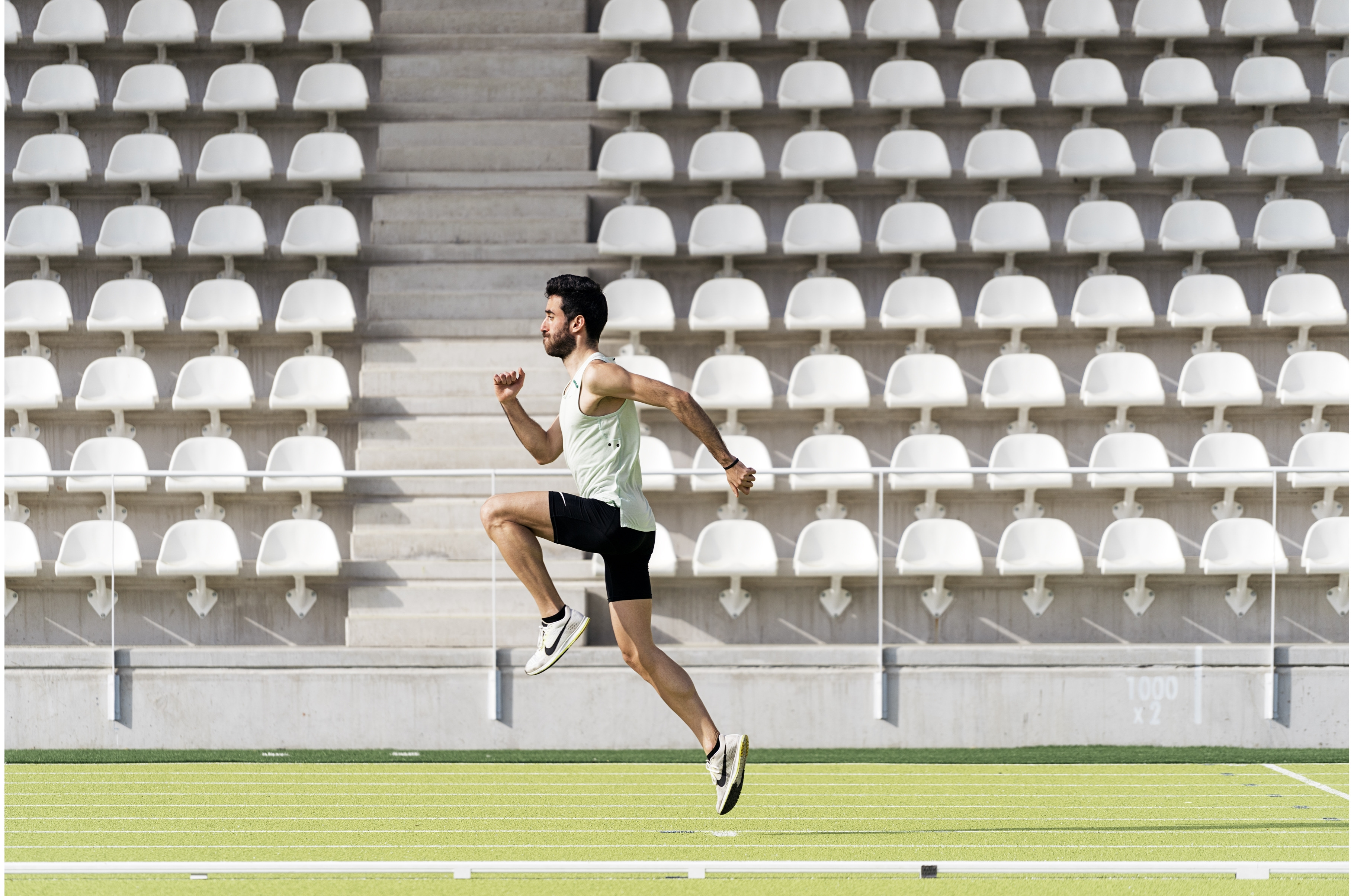 Athlete Practicing in Athletic Track, a Person Photo by nunezimage