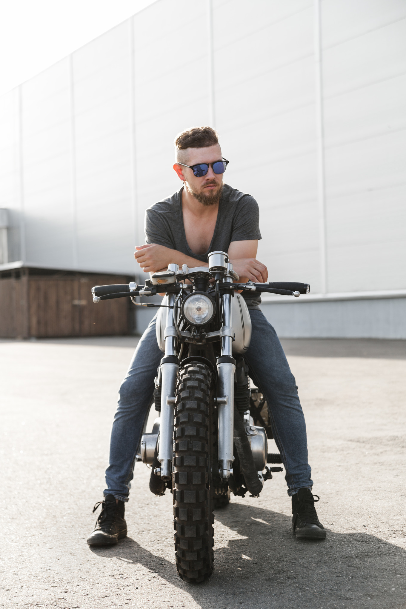Rider guy with classic style cafe racer motorcycle containing background, a Transportation Photo ...