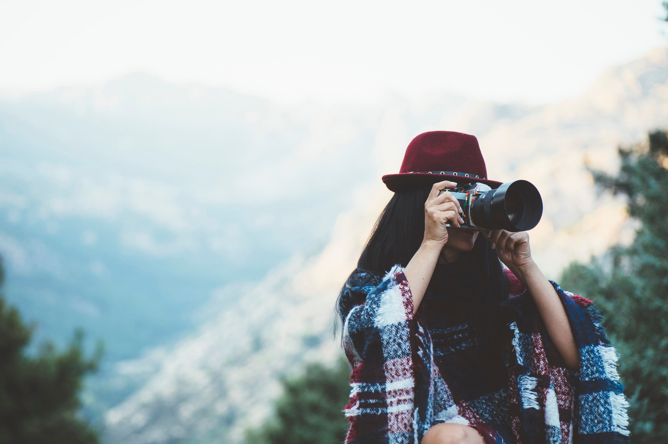 Woman taking picture outdoors containing pedriza, camera, and explore ...