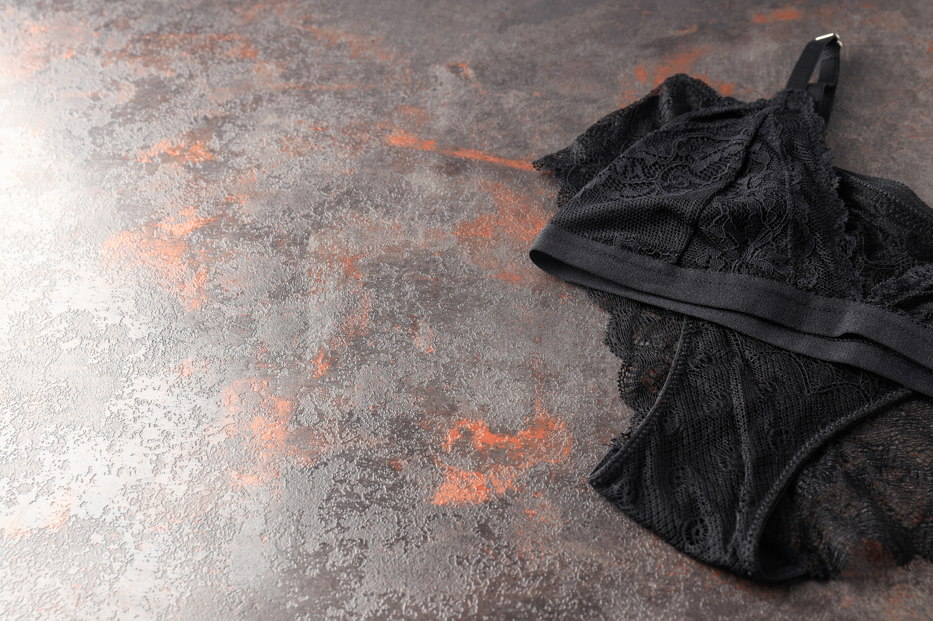 Black set of women's underwear on textured background, a Beauty ...